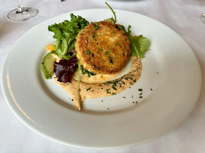 This crab cake doesn't play games with fillers&mdash;it's all about the sweet Dungeness meat, crispy exterior, and that silky remoulade underneath.