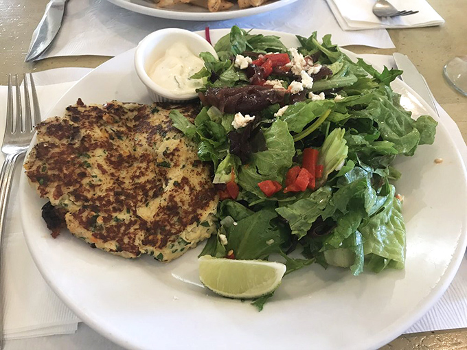 The star of the show: a golden-brown crab cake that's almost entirely seafood, not filler&mdash;paired with greens that aren't just an afterthought.