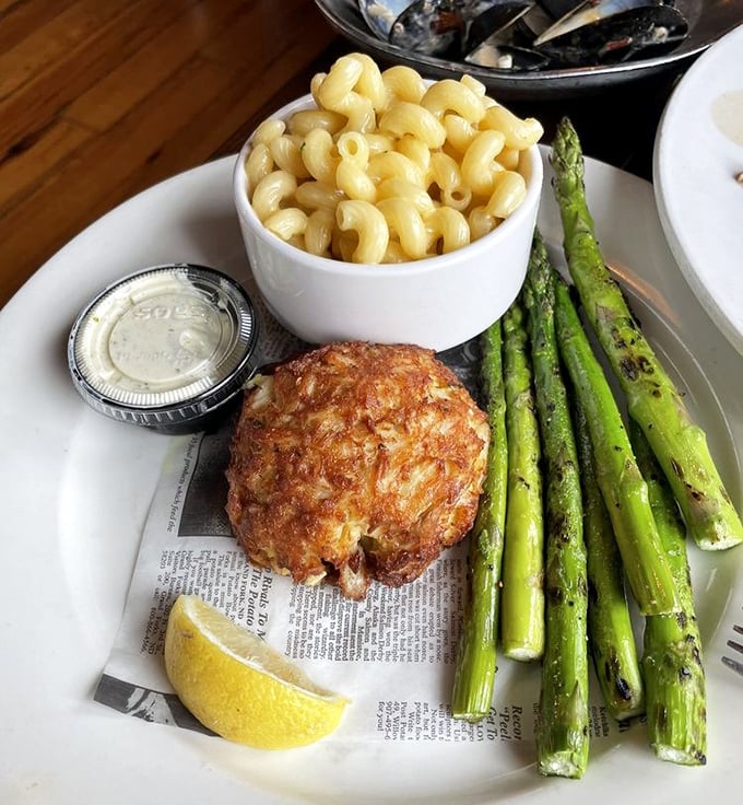 The holy trinity of Maryland dining: a perfectly golden crab cake, creamy mac and cheese, and grilled asparagus. Simplicity that speaks volumes.