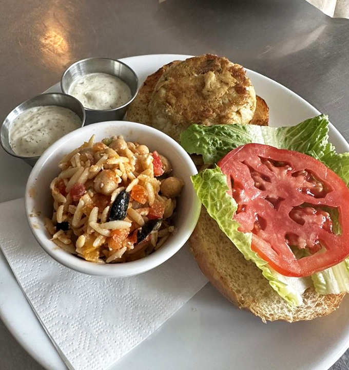 A crab cake sandwich that doesn't hide behind fillers&mdash;just pure, sweet crabmeat on a brioche throne with a side of summer in a bowl.