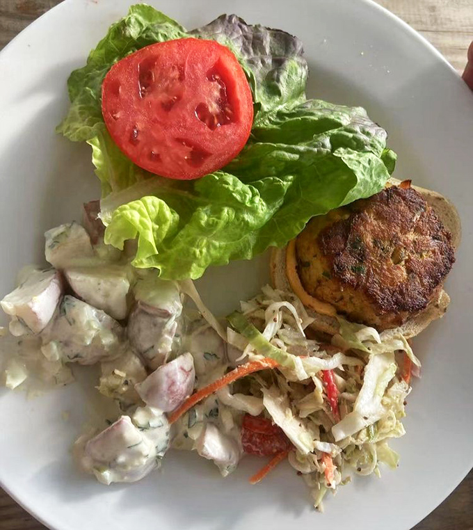 Behold the star of the show&mdash;a golden-brown crab cake that's more crab than cake, served with classic sides that know their supporting role.