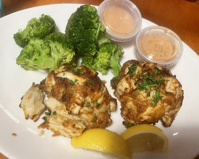 These golden-brown crab cakes are what seafood dreams are made of—mostly crab, minimal filler, maximum flavor. The broccoli's just there for moral support.