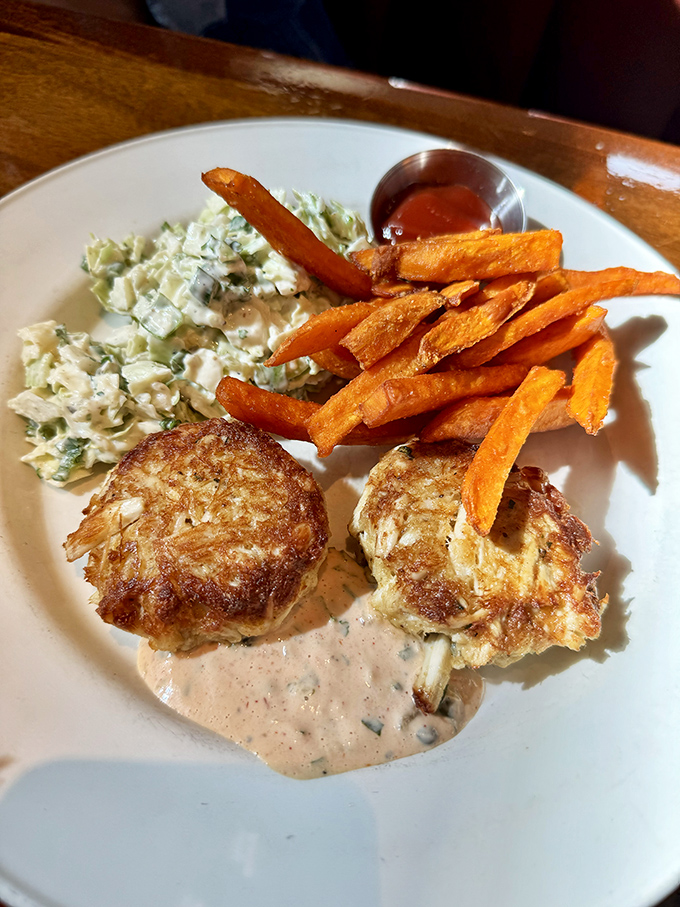Golden-brown crab cakes that don't skimp on the good stuff, paired with sweet potato fries that could make a Southerner weep with joy.