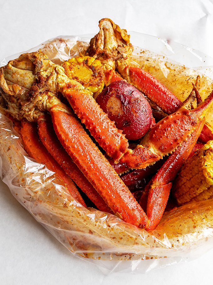 These crab legs aren't just food&mdash;they're an event. Glistening with seasoning and ready to surrender their sweet meat to determined diners.