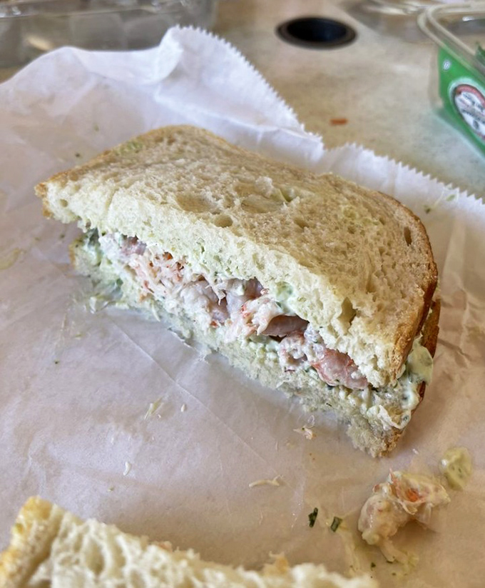 This crab sandwich isn't just lunch; it's a coastal California experience nestled between two perfectly soft slices of fresh bread.