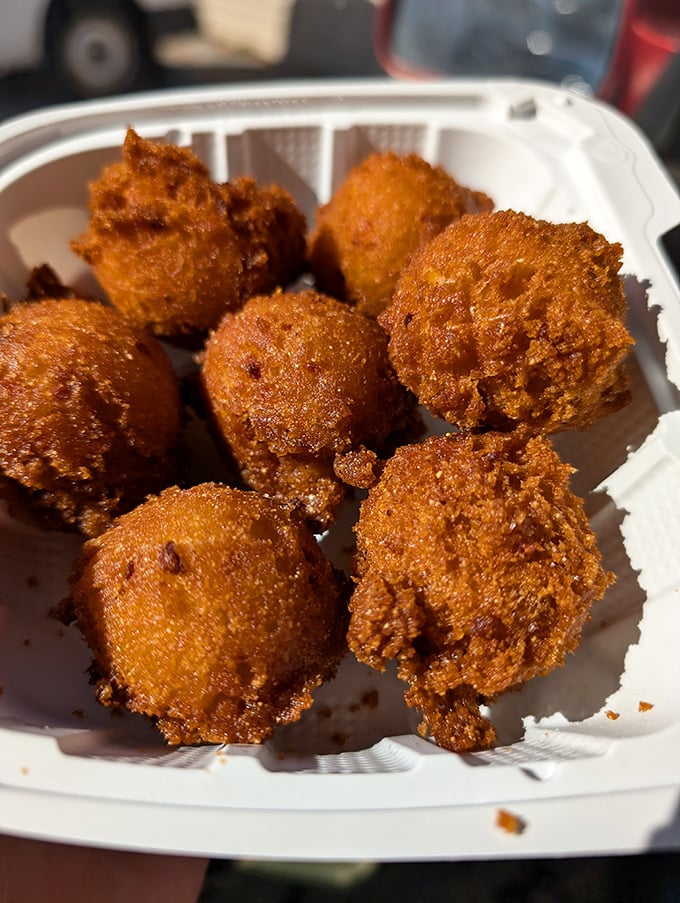 Golden-brown perfection! These hush puppies aren't just fried dough&mdash;they're little orbs of cornmeal joy waiting to complement your seafood feast.