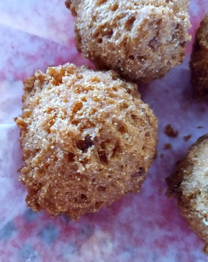 These golden-brown hushpuppies aren't just side dishes; they're little spheres of cornmeal joy that deserve their own fan club and commemorative t-shirt.