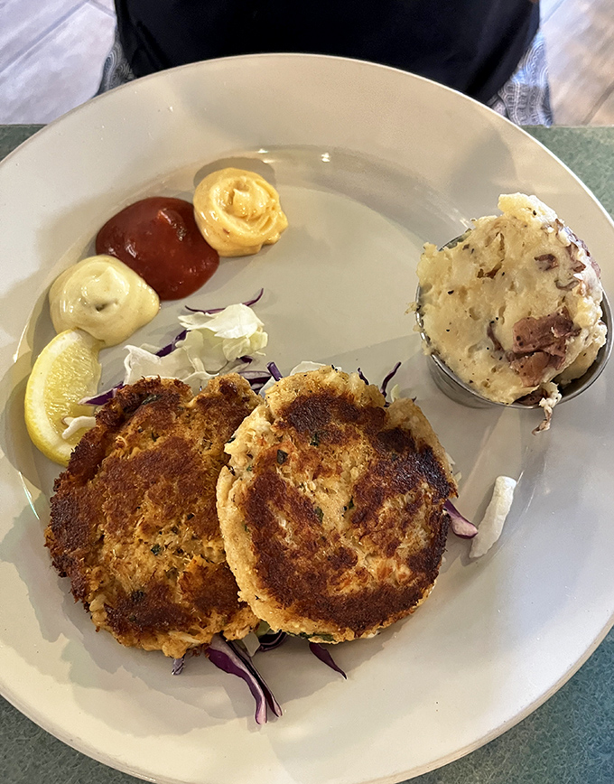 These golden-brown beauties are what happens when crab cakes achieve their final, most perfect form.