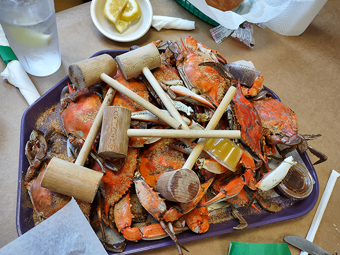Wooden mallets standing at attention atop a mountain of Old Bay-dusted blue crabs&mdash;nature's puzzle boxes filled with sweet rewards for the patient.