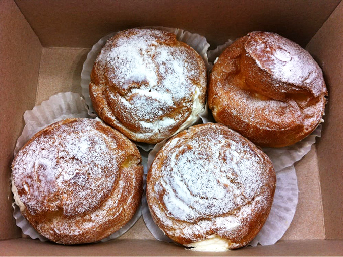 These cream puffs aren't just desserts&mdash;they're cloud-like vessels of joy dusted with powdered sugar promises. Worth every mile of the drive.