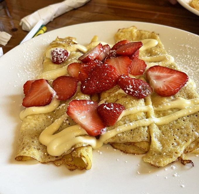 These crepes don't just arrive at your table &ndash; they make an entrance, dressed in fresh strawberries and cream that would make a French pastry chef nod approvingly.