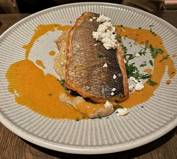 The legendary crispy branzino that launched a thousand road trips. That skin shatters like delicate glass while the fish beneath remains perfectly tender.