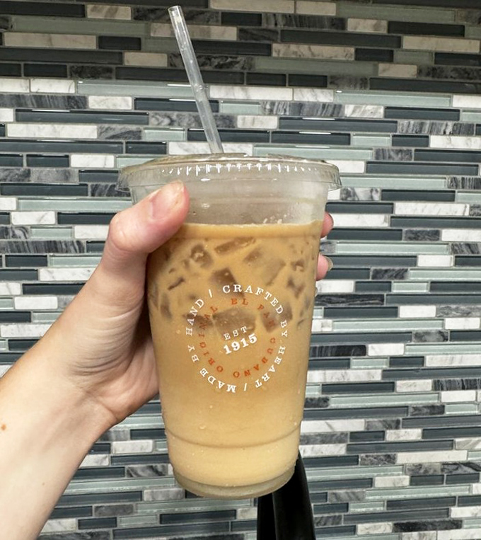 Iced Cuban coffee: where caffeine meets vacation vibes. This cup contains enough energy to power a small city, all while tasting like liquid dessert.