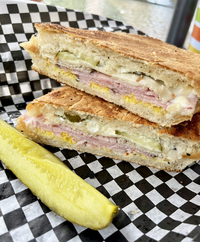 This Cuban sandwich isn't just pressed—it's been convinced to reveal its deepest, most delicious secrets between layers of perfectly crisp bread.