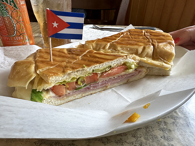 The Cuban sandwich arrives with its own tiny flag, as if to say "I'm so good, I deserve my own nation."