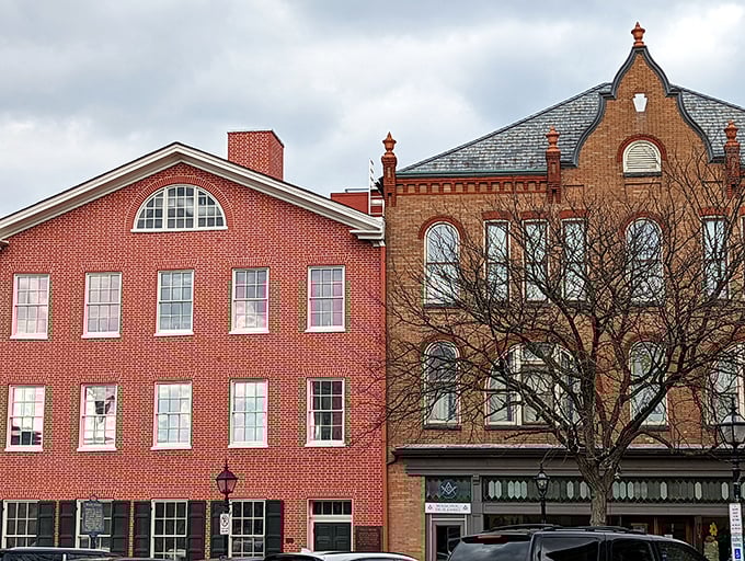 Historic buildings stand shoulder-to-shoulder like old friends sharing decades of stories along these tree-lined streets.