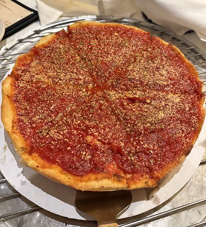 The deep dish here isn't Chicago's famous skyscraper-in-a-pan style, but a perfect middle ground—substantial enough to satisfy without requiring a nap afterward.
