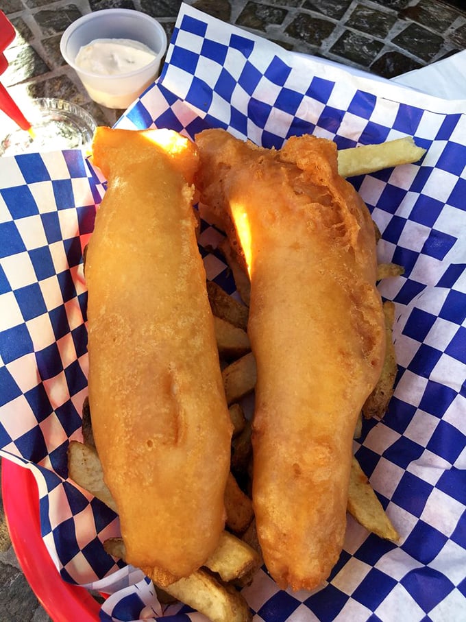 Two magnificent pieces of cod wearing their golden armor, ready to make your taste buds sing hallelujah.