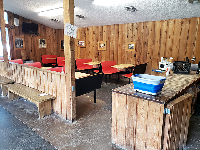 The cavern's rustic dining area offers a place to refuel after your underground expedition. Those red chairs have heard some tall spelunking tales.