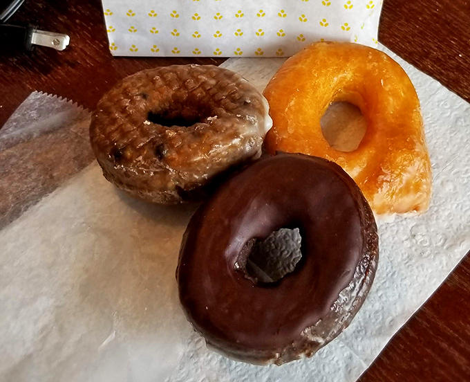 Three perfect circles of joy &ndash; the holy trinity of donuts. One glazed, one chocolate, one classic &ndash; all guaranteed to make Monday bearable.