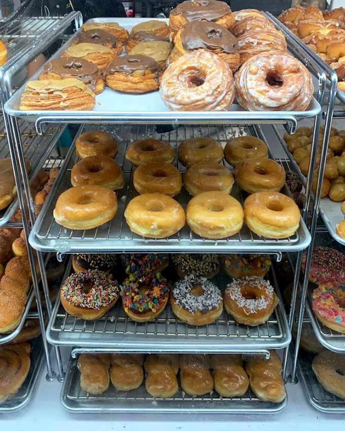 Donut heaven exists, and it's arranged on metal racks in Newport Beach. The hardest life decision: glazed, sprinkled, or "yes, all of them."