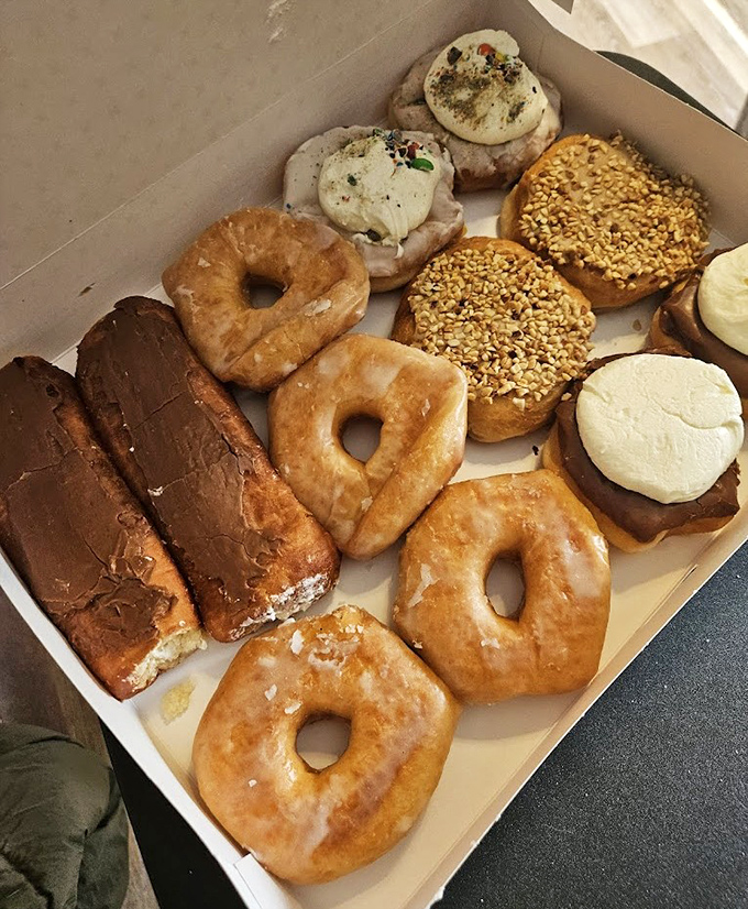 Donut heaven in cardboard form. The box that makes office meetings bearable and family gatherings legendary. Diet plans, beware.