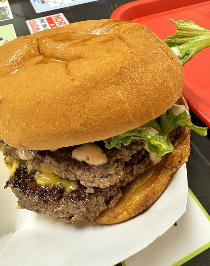 Behold the Double Mac &ndash; where multiple beef patties unite in a glorious tower of flavor that requires both hands and zero shame.