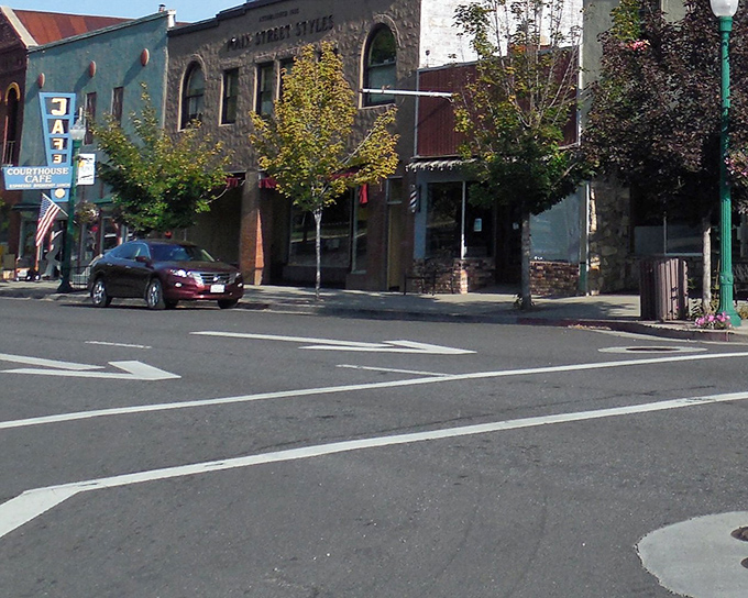 Classic small-town streetscape where parking spaces outnumber traffic jams by comfortable margins every day.