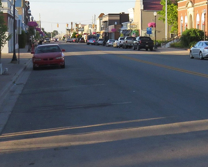 Downtown Cheboygan unfolds like a Norman Rockwell painting come to life, complete with classic American cars and storefronts straight from simpler times.