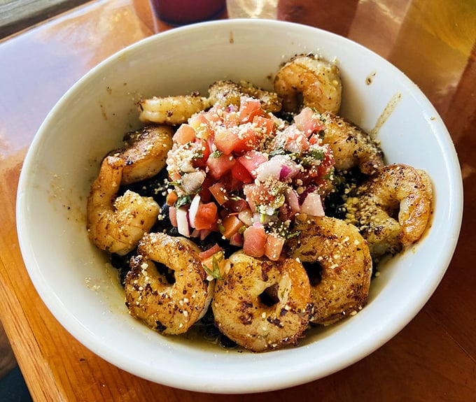 The legendary Drunken Shrimp Bowl &ndash; where plump Gulf shrimp party with fresh pico de gallo in a celebration that's worth every calorie.