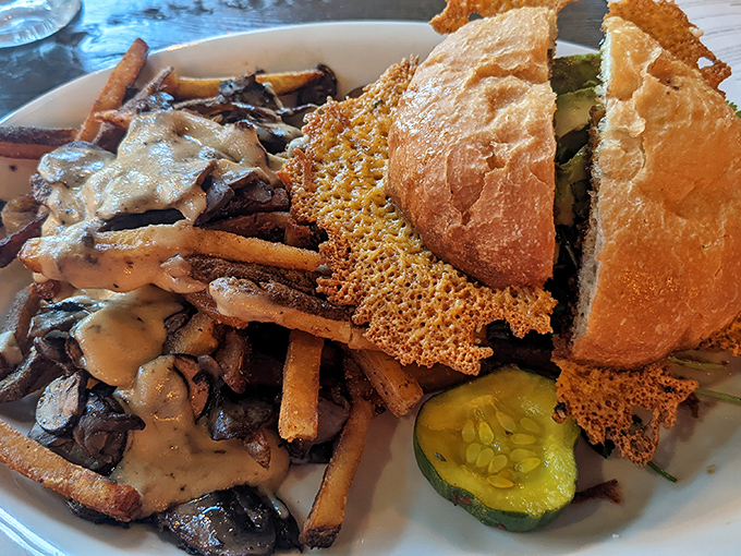 The Duck Burger arrives like royalty with its crispy cheese crown and mushroom entourage. Proof that ducks can fly straight to flavor heaven.