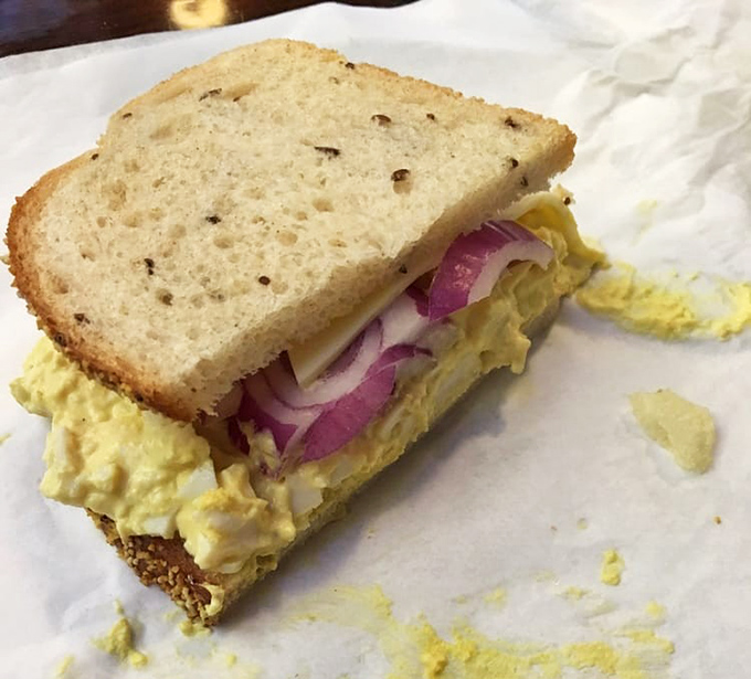 The legendary egg salad sandwich in all its unpretentious glory&mdash;where red onion adds bite, rye bread provides structure, and nostalgia serves as the secret ingredient.
