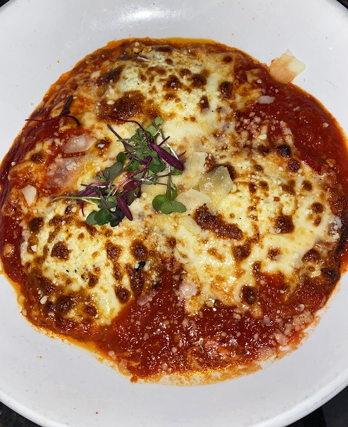 This eggplant parmesan isn't just food; it's edible artwork. Perfectly melted cheese blankets tender eggplant in a marinara sea that would make Neptune himself request seconds.