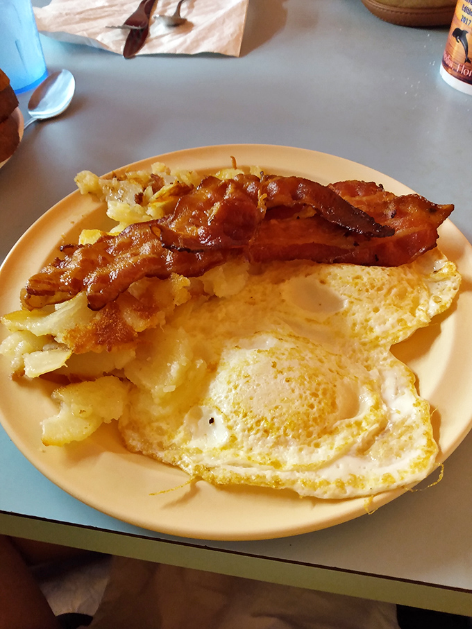 Eggs cooked to perfection alongside bacon that actually tastes like bacon should &ndash; crispy, substantial, and unapologetic.