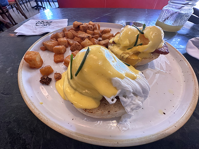 Eggs Benedict: where breakfast meets art. Those golden yolks are about to create the sauce that dreams are made of.