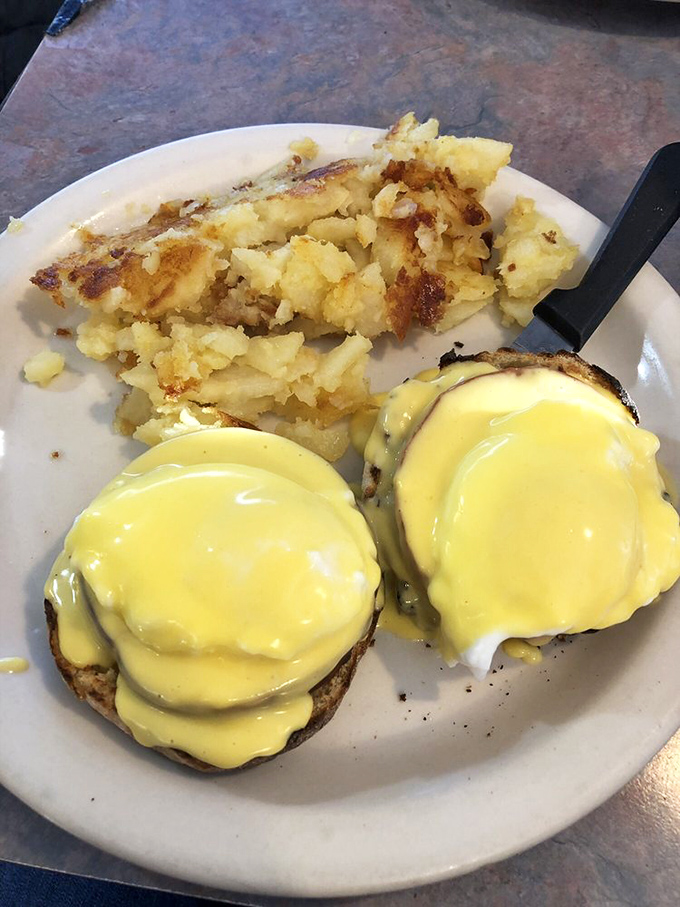 Eggs Benedict that would make a cardinal sin &ndash; perfectly poached eggs draped in hollandaise that cascades like a yellow waterfall over English muffins.