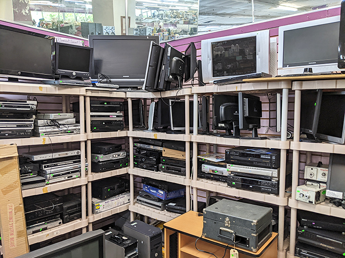 Electronics graveyard or tech paradise? You decide while browsing vintage stereos and modern marvels alike.