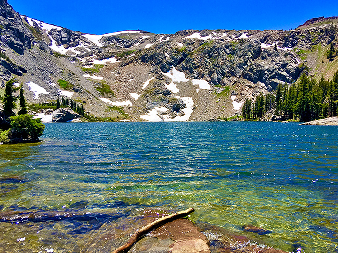 Emigrant Lake sparkles like nature's own infinity pool, reflecting snow-capped peaks that would make Swiss postcards jealous.