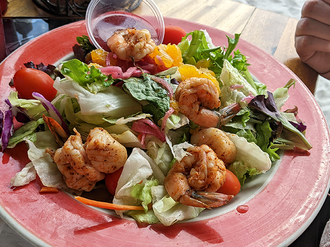 Fresh greens meet ocean treasures in this colorful symphony that screams "healthy never tasted so good."