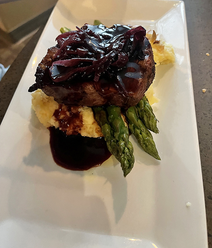 This filet mignon doesn't just sit on the plate&mdash;it presides over it, with asparagus soldiers standing at attention and mashed potatoes catching every drop of that glorious sauce.