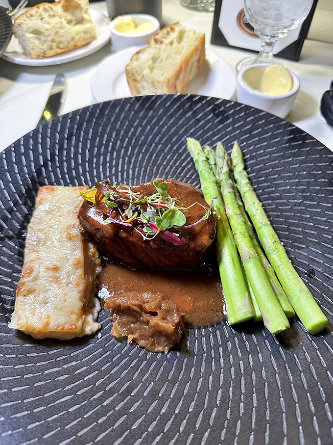 This isn't just filet mignon; it's a masterclass in timing and technique. The asparagus stands at attention, knowing it's in the presence of greatness.
