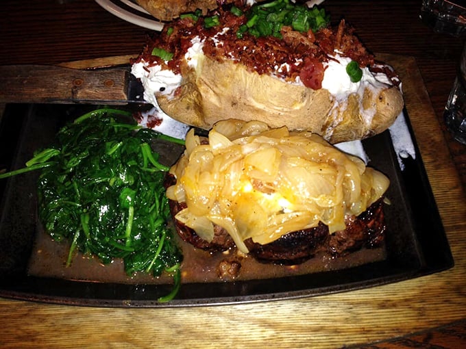 This isn't just dinner&mdash;it's edible art. A perfectly seared steak topped with melted cheese alongside a loaded baked potato and fresh greens creates the holy trinity of steakhouse perfection.