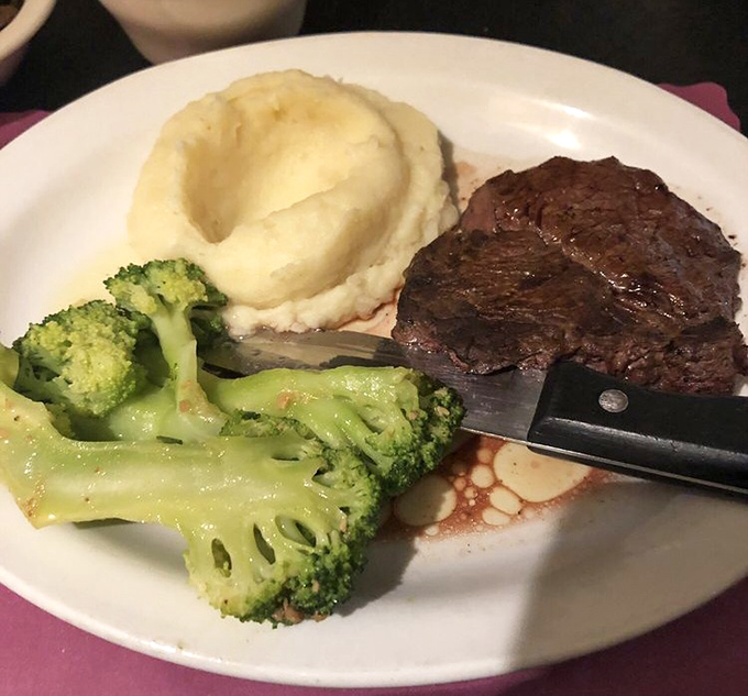 This isn't just dinner, it's a work of art—perfectly seared filet mignon alongside fluffy mashed potatoes and vibrant broccoli.