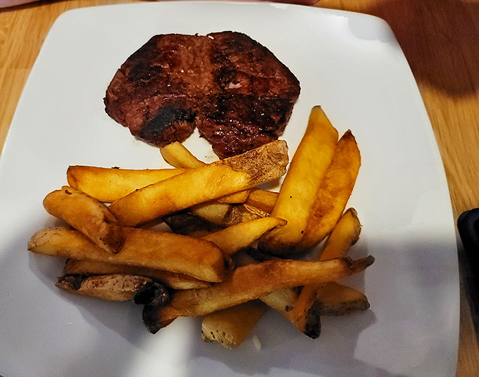 This filet mignon doesn't just melt in your mouth&mdash;it performs a full Broadway musical there. Golden fries stand ready for their supporting role.