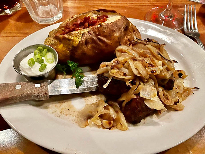 A loaded baked potato and steak with caramelized onions &ndash; proof that happiness doesn't need to be complicated, just perfectly executed.