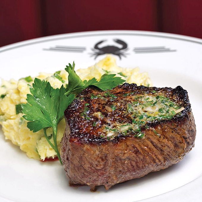 A perfectly seared filet that doesn't need a passport to transport you to steakhouse heaven. That herb butter melting on top? Pure poetry.