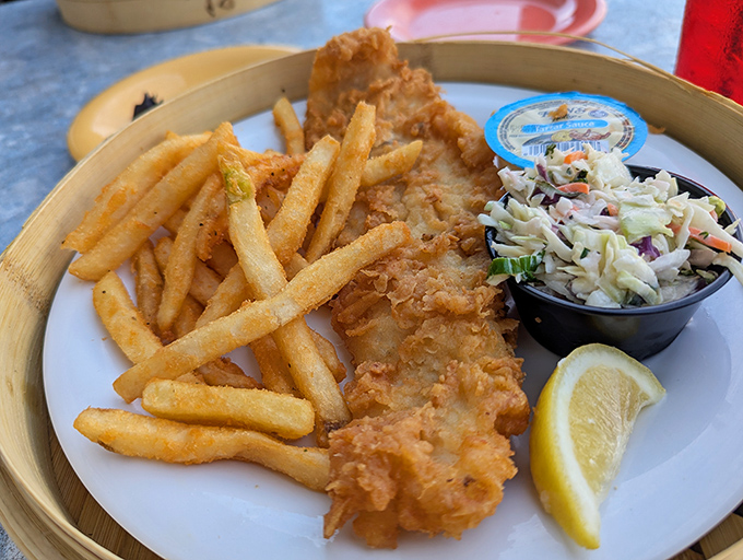 Behold the golden glory that launched a thousand return visits &ndash; crispy perfection meets flaky fish heaven.