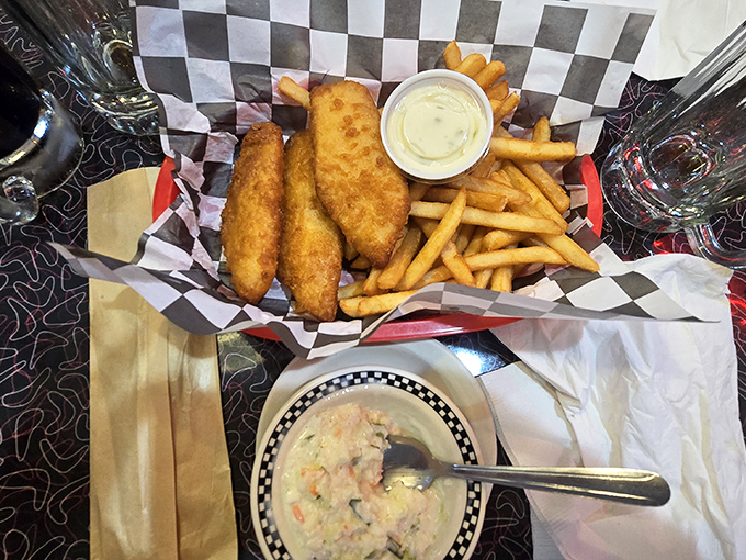 Golden-battered fish and crispy fries served in a checkered basket &ndash; proof that sometimes the simplest pleasures are the ones worth driving across state lines for.