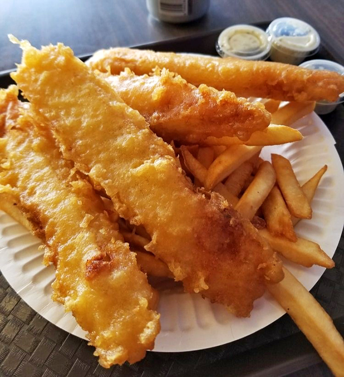 Golden armor protecting tender white fish flanked by crispy soldiers of potato. This plate isn't just food &ndash; it's edible sunshine.