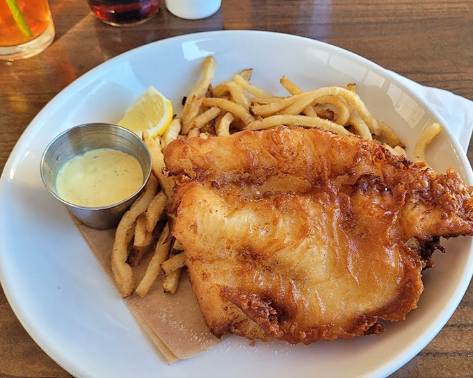 Golden-battered fish meets perfectly crisp fries in this plate of happiness. The fish practically winks at you, saying "I'm worth the trip."